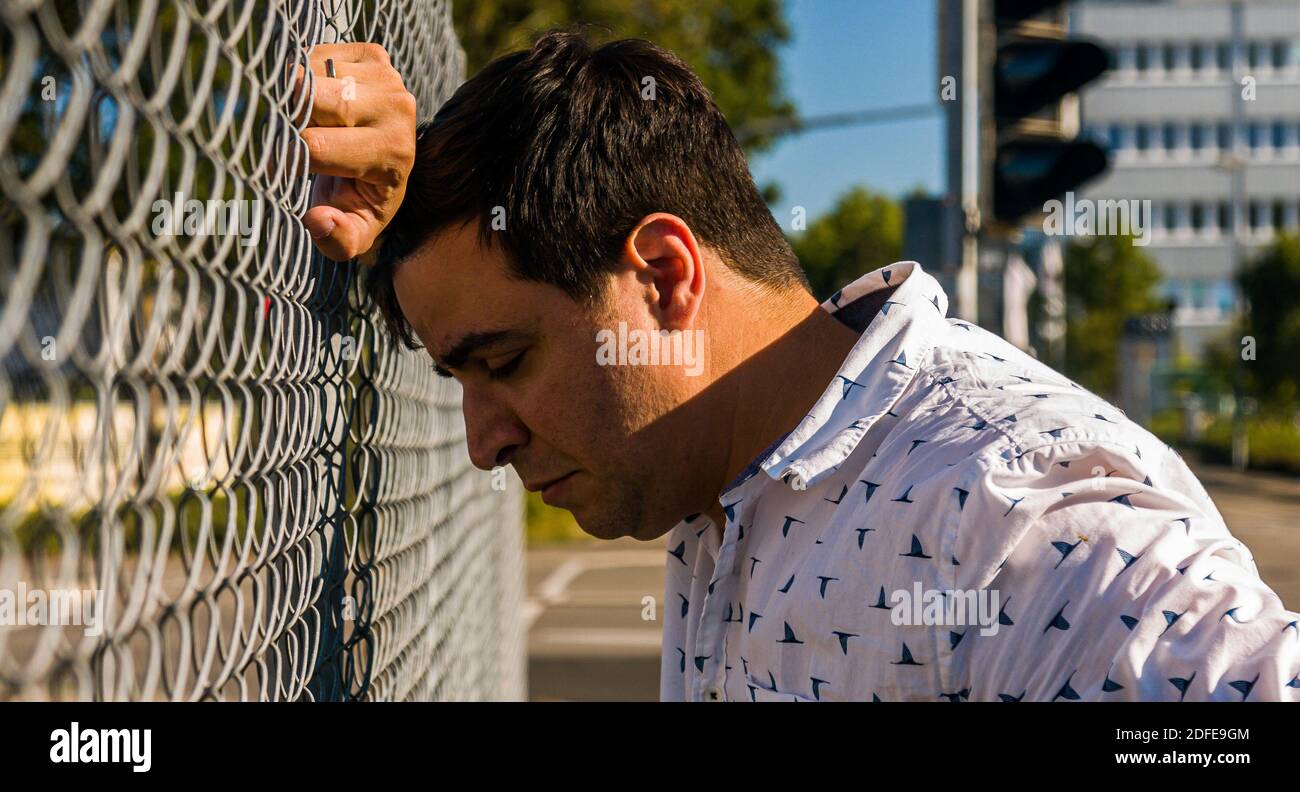 Old man leaning fence hi-res stock photography and images - Alamy