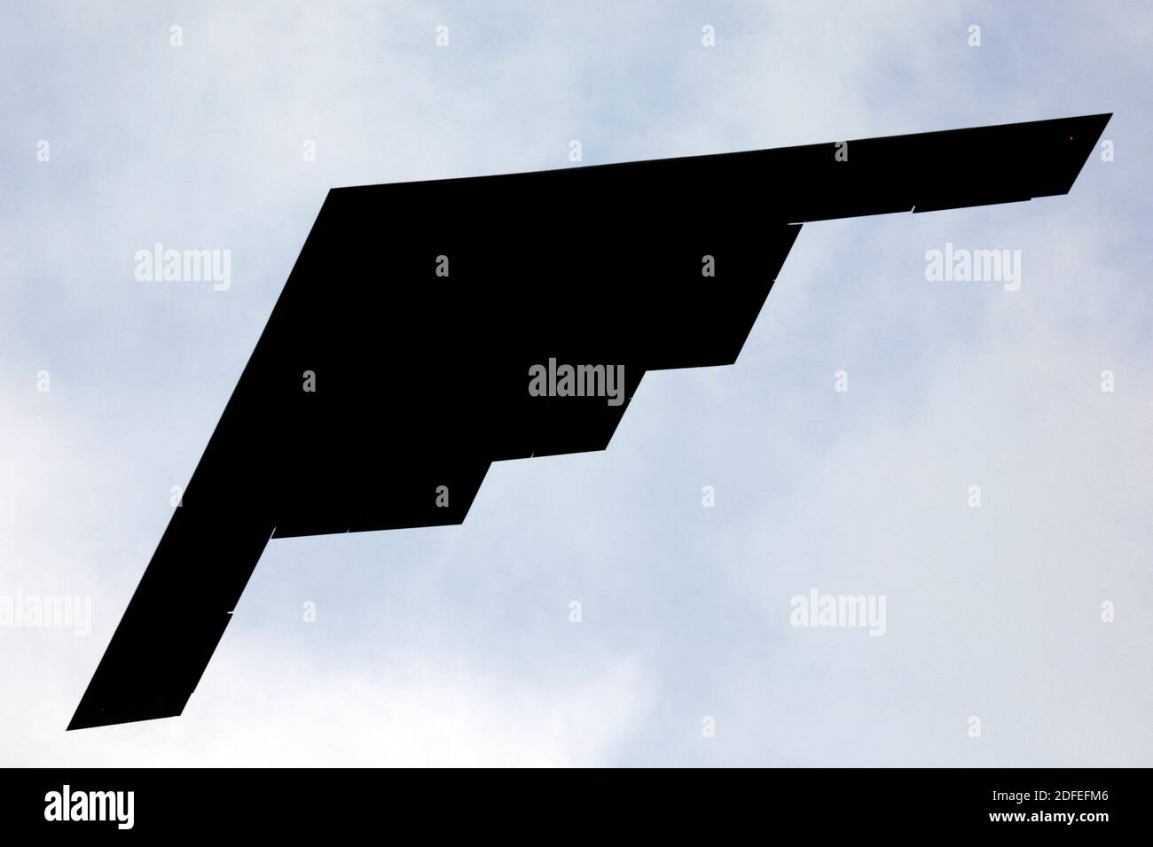 The B2 Stealth Bomber flies over as U.S. President Donald Trump and ...