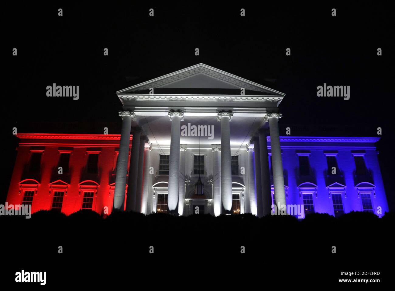 The White House is illuminates in red, white and blue colors to mark ...