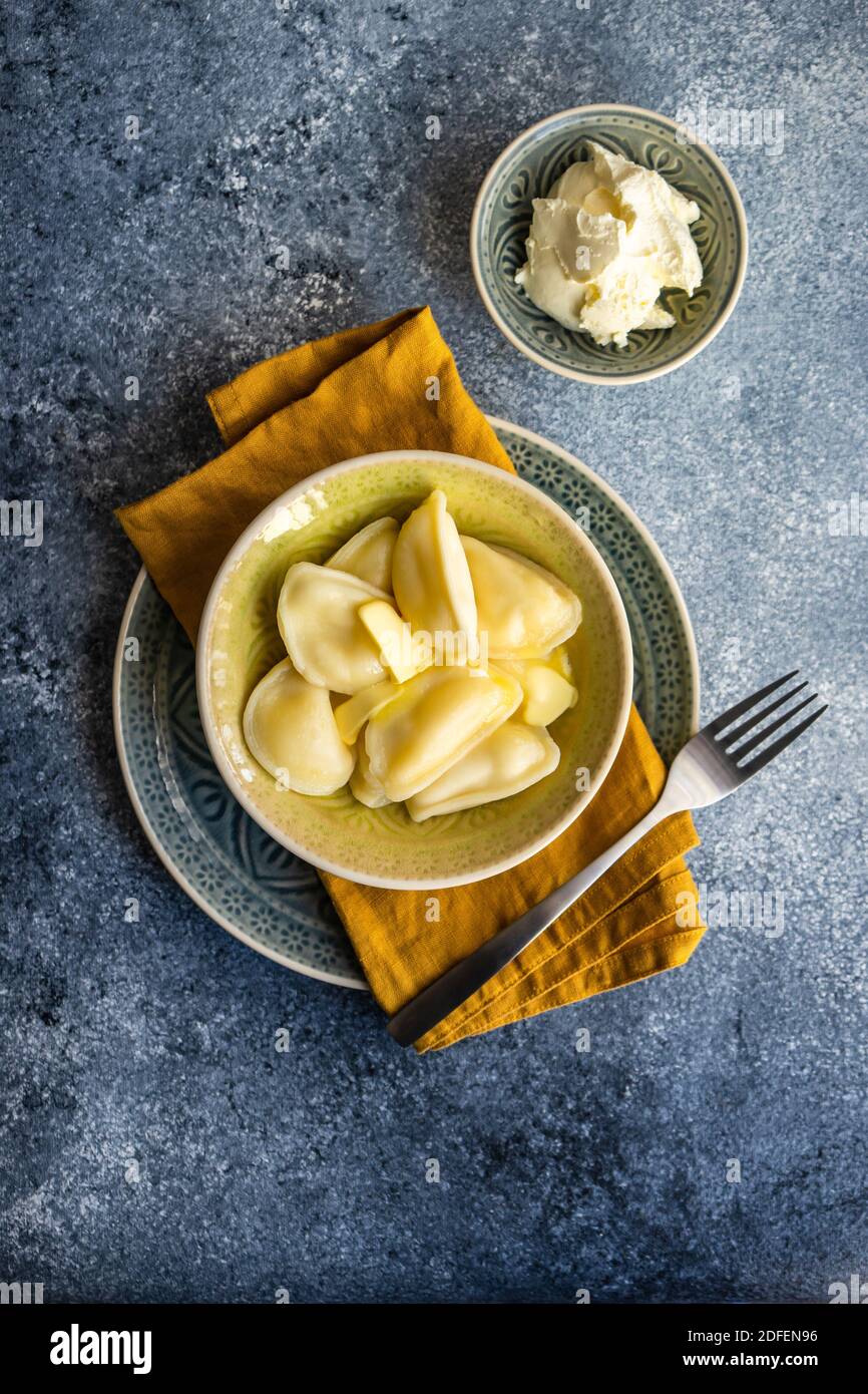Traditional ukrainian dish vareniki with cheese served in a bowl with ...