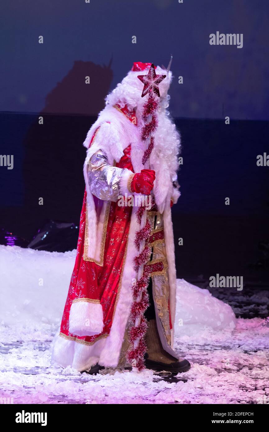 Emotional Santa Claus with a long white beard in a red coat and white ...