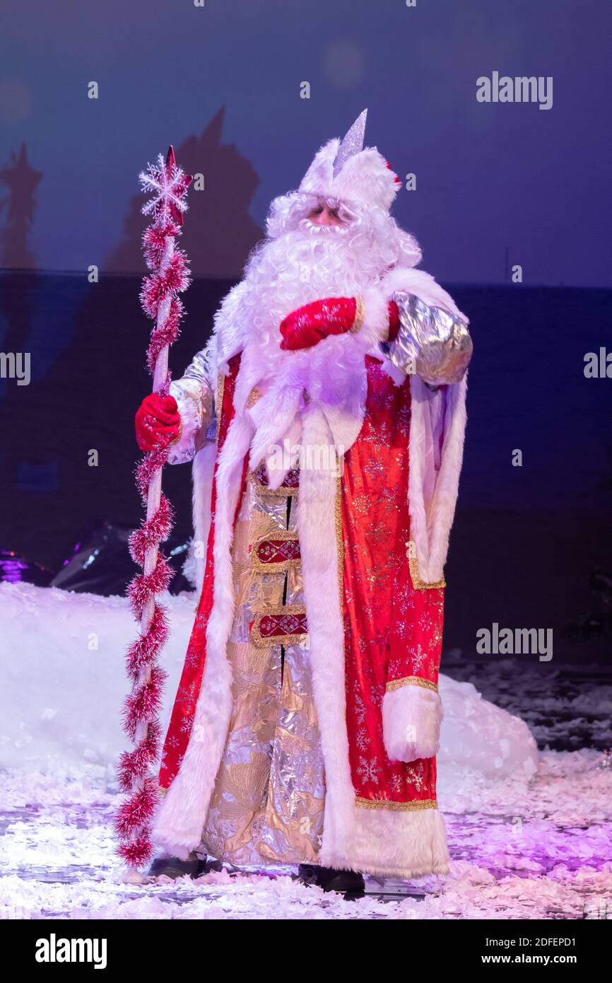 Emotional Santa Claus with a long white beard in a red coat and white ...
