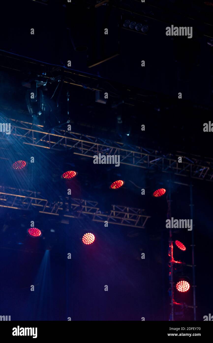 An empty stage of the theater, lit by spotlights and smoke before the ...