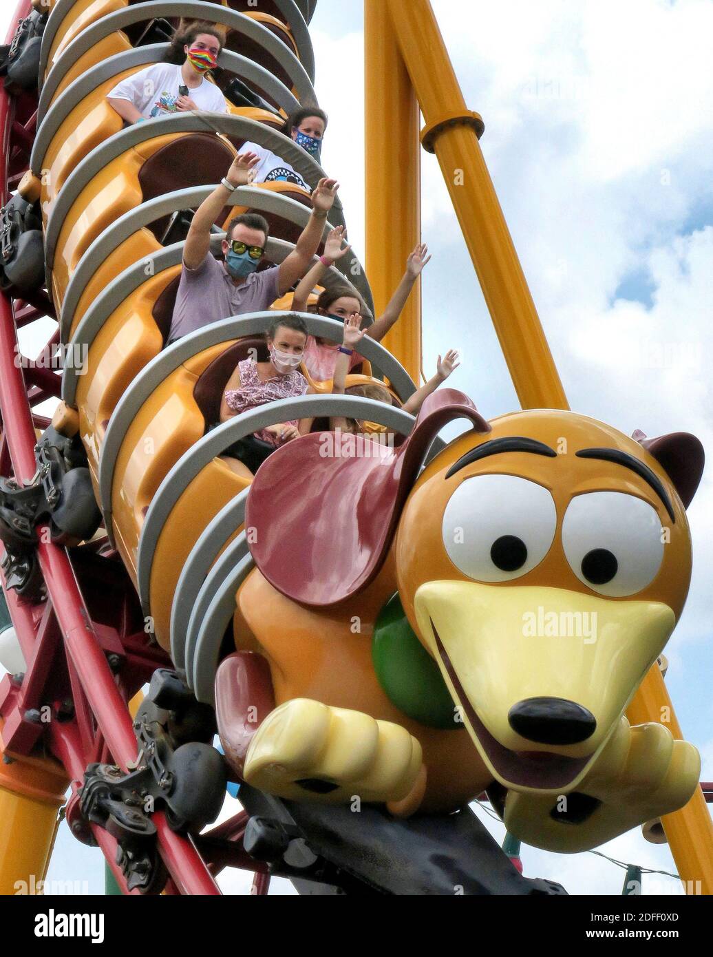 NO FILM, NO VIDEO, NO TV, NO DOCUMENTARY - Guests ride the Slinky Dog ...