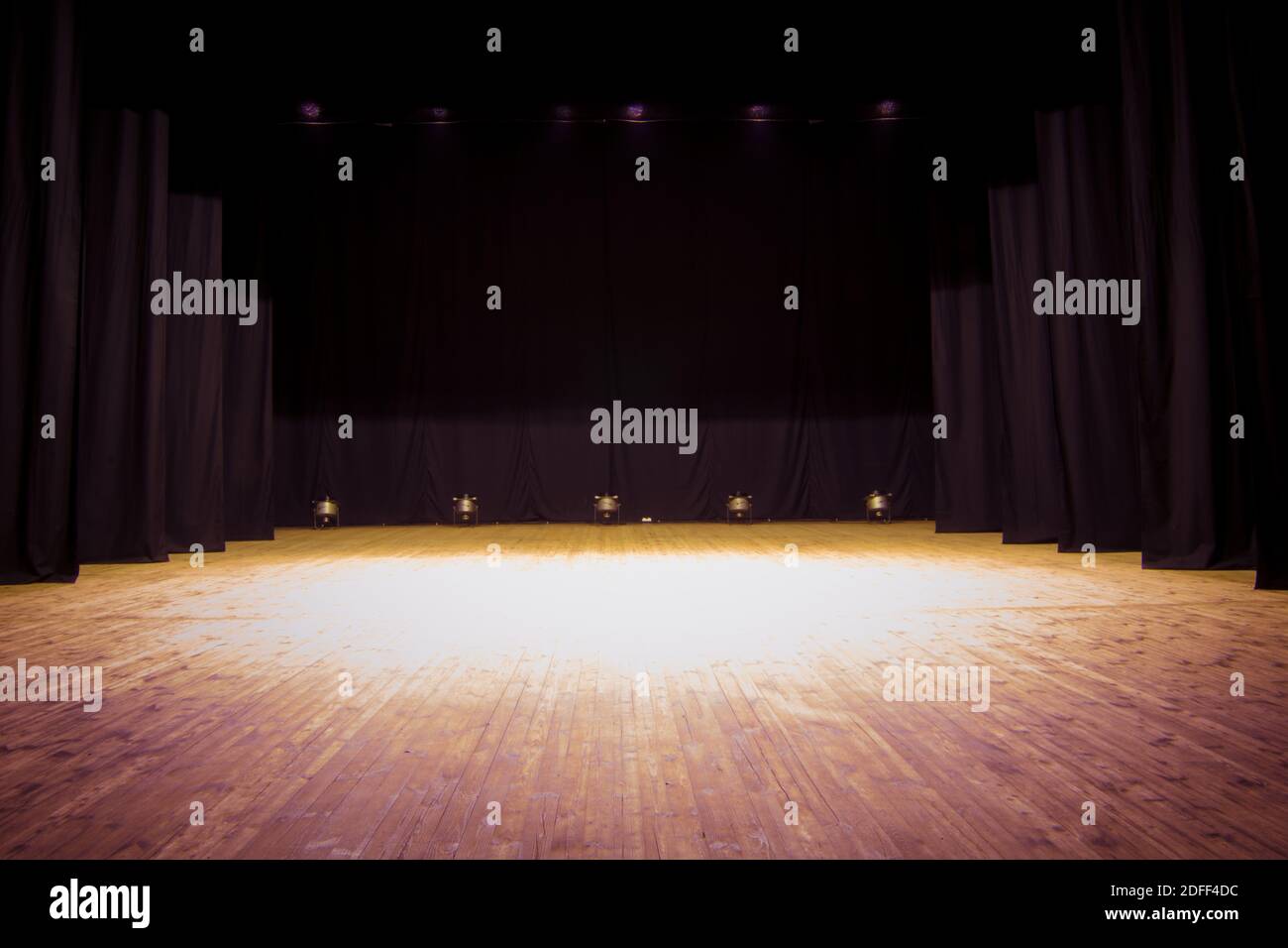 An empty stage of the theater, lit by spotlights before the performance ...
