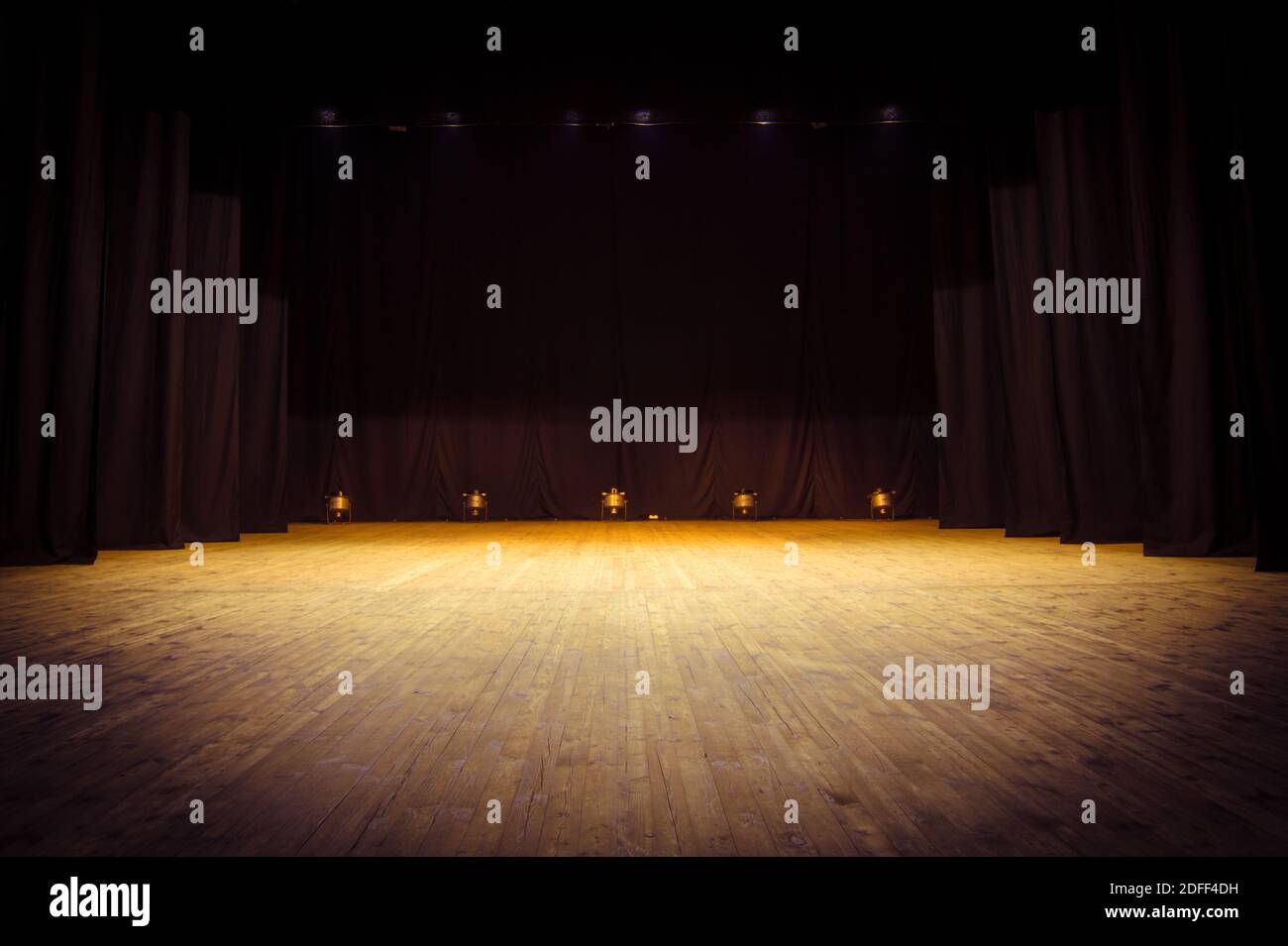 An empty stage of the theater, lit by spotlights before the performance ...