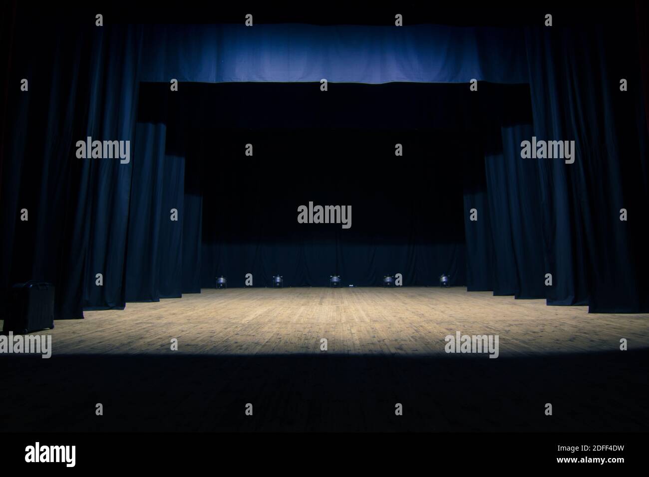 An empty stage of the theater, lit by spotlights before the performance ...