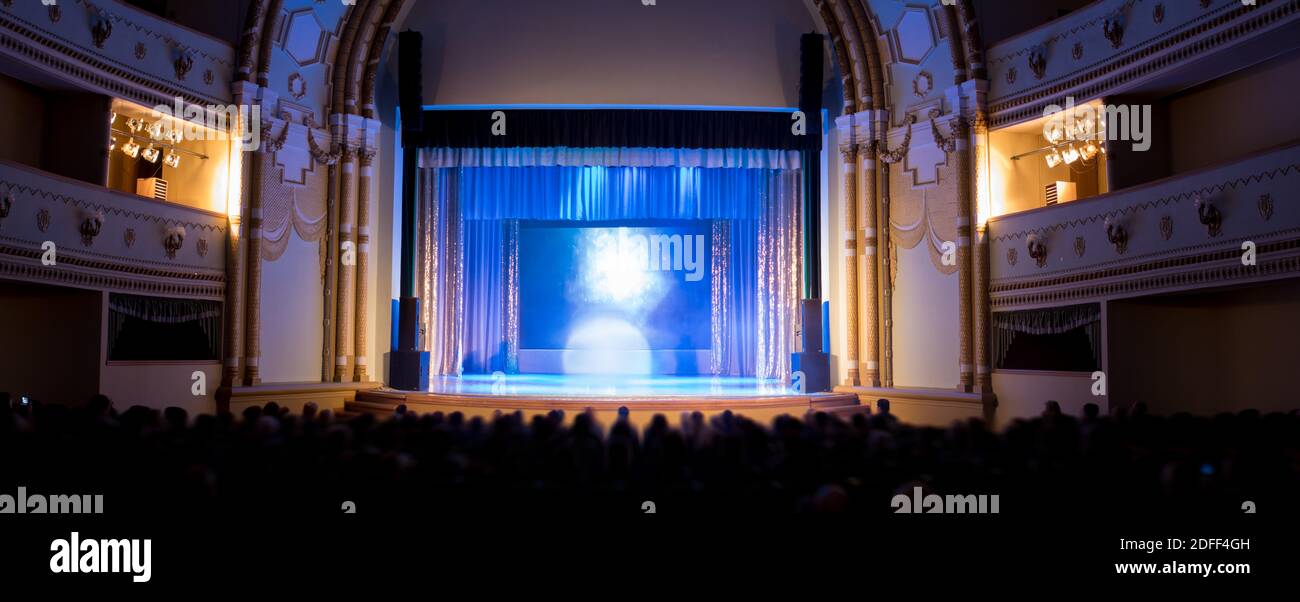 An empty stage of the theater, lit by spotlights before the performance ...
