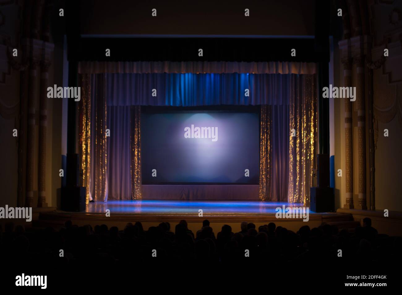 An empty stage of the theater, lit by spotlights before the performance ...