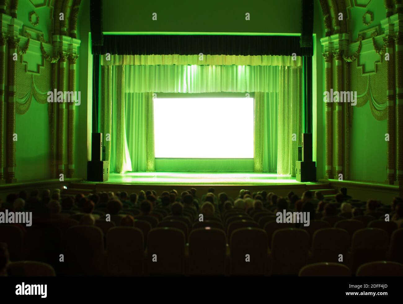 An empty stage of the theater, lit by spotlights and smoke before the ...