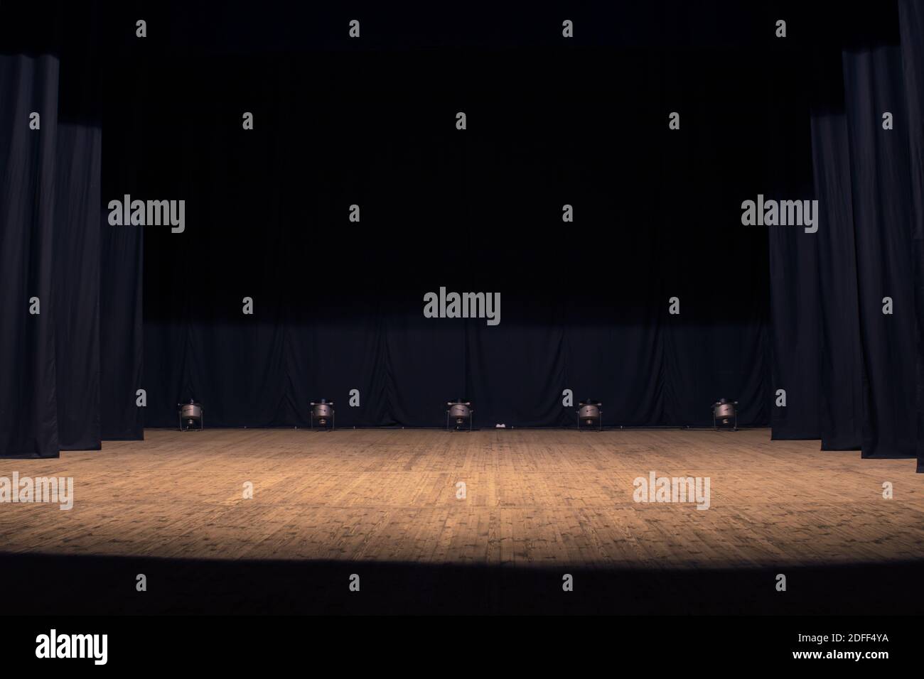 An empty stage of the theater, lit by spotlights before the performance ...