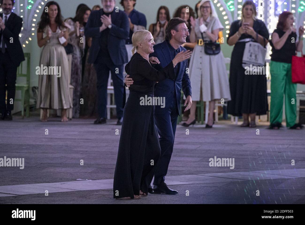 Maria Grazia Chiuri and Pietro Beccari attend the fashion show for the ...