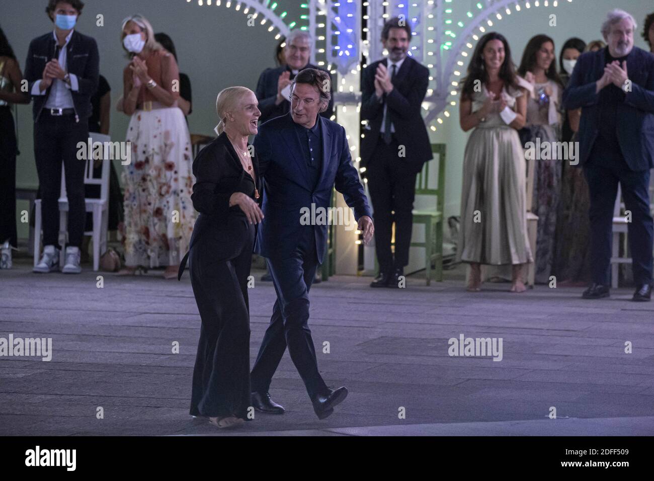 Maria Grazia Chiuri and Pietro Beccari attend the fashion show for the ...