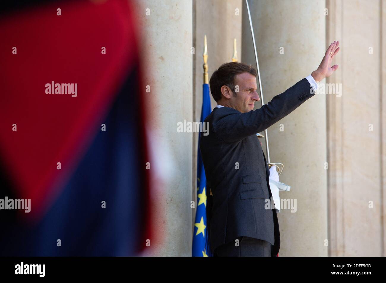 French President Emmanuel Macron waves as he escorts Cyprus' president ...