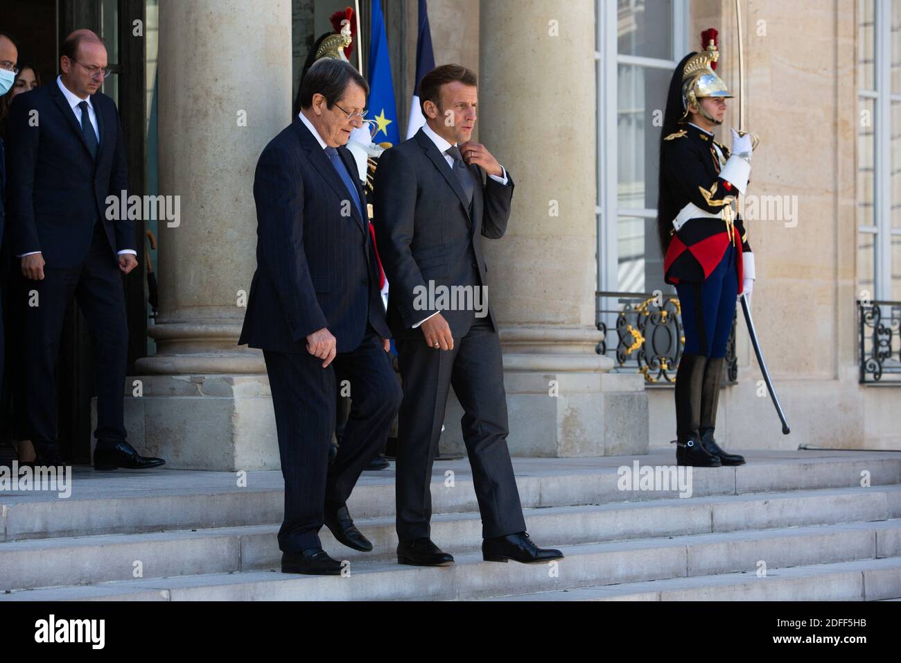 French President Emmanuel Macron escorts Cyprus' president Nicos ...