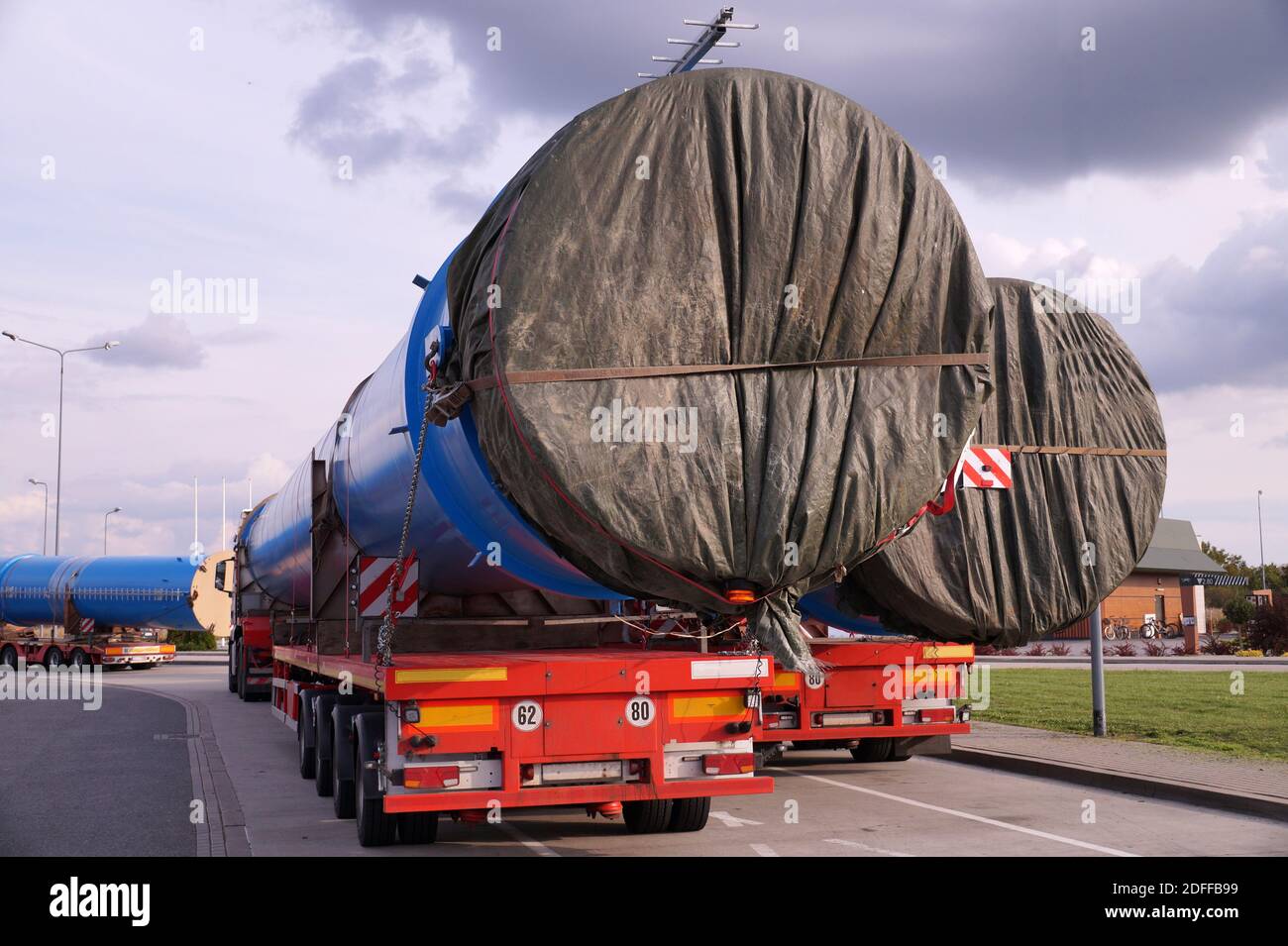 A trucks with a special semi-trailers for transporting oversized loads. Oversize load or ...