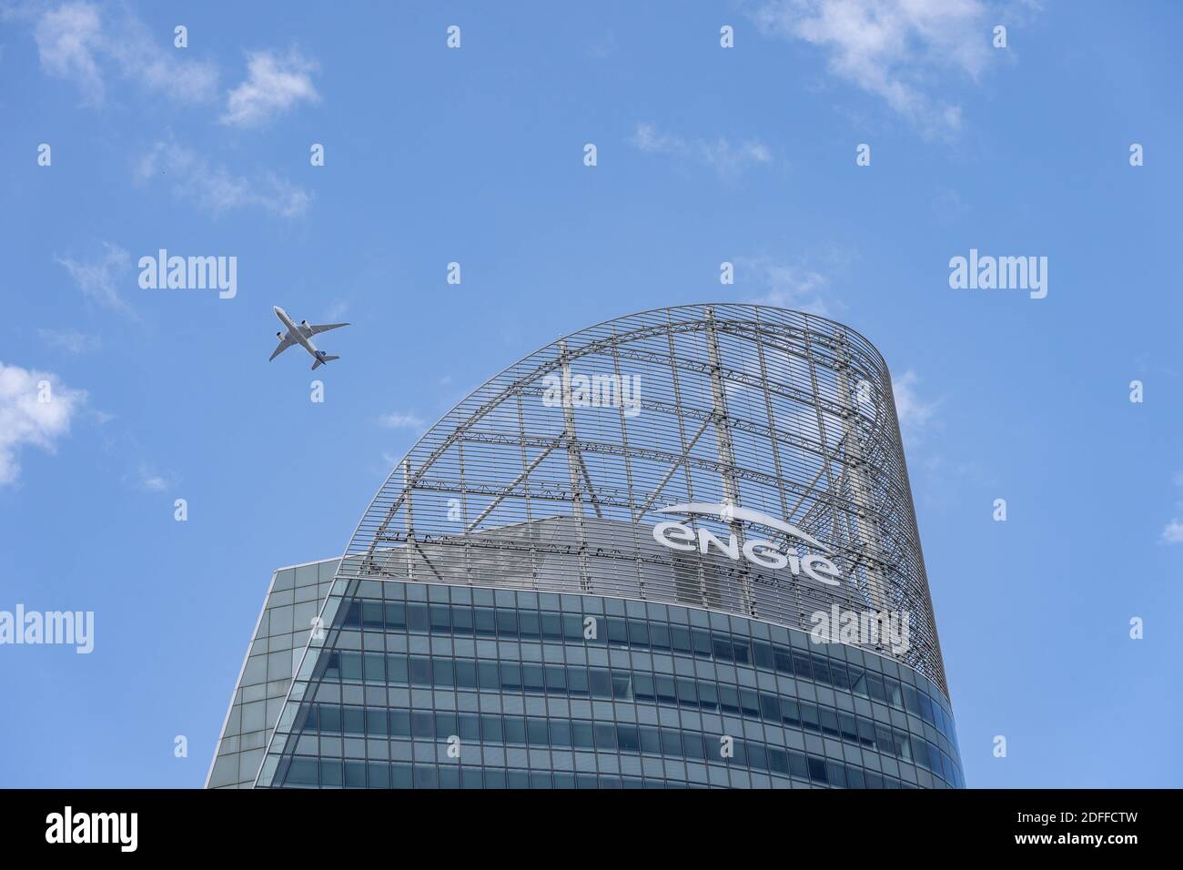 Paris, France - Jun 13, 2020: Plane fly over Tour T1 Engie skyscraper ...