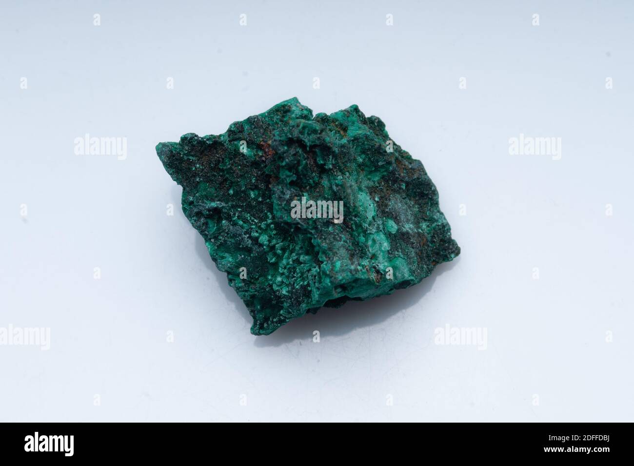 Malachite green ore on a white background. Natural green malachite ...