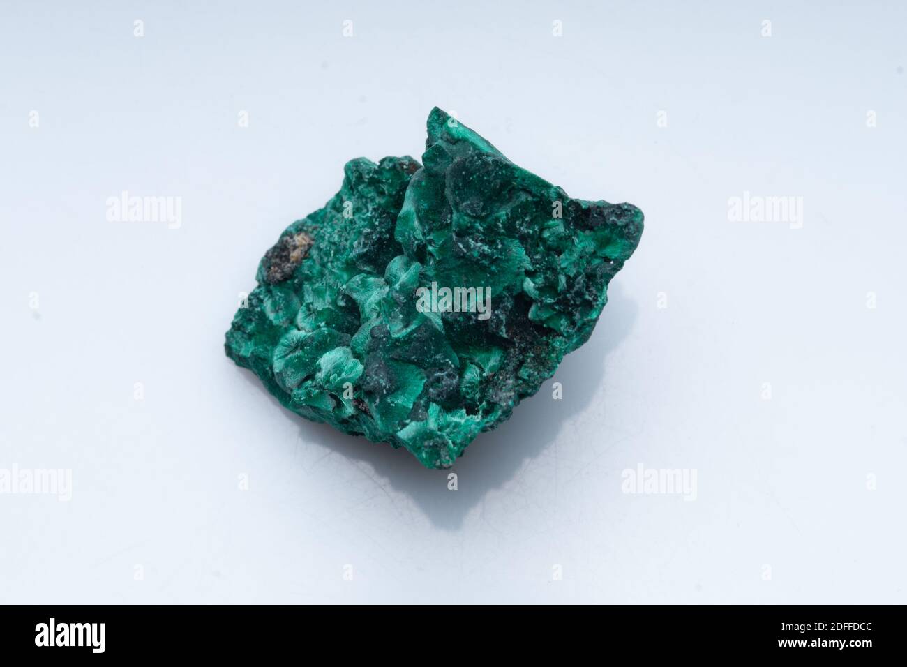Malachite green ore on a white background. Natural green malachite ...