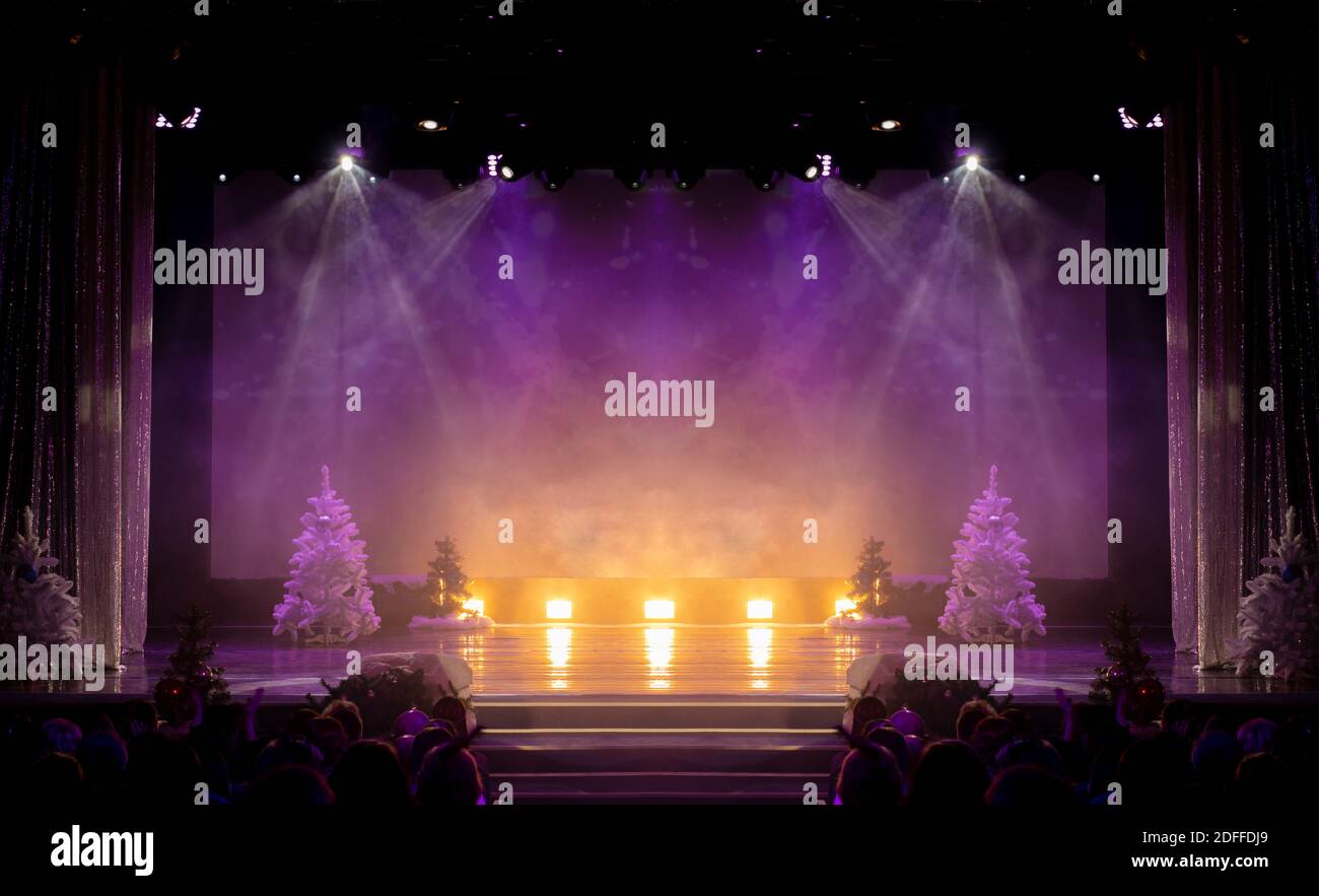 scene, stage light with colored spotlights and smoke, christmas tree ...