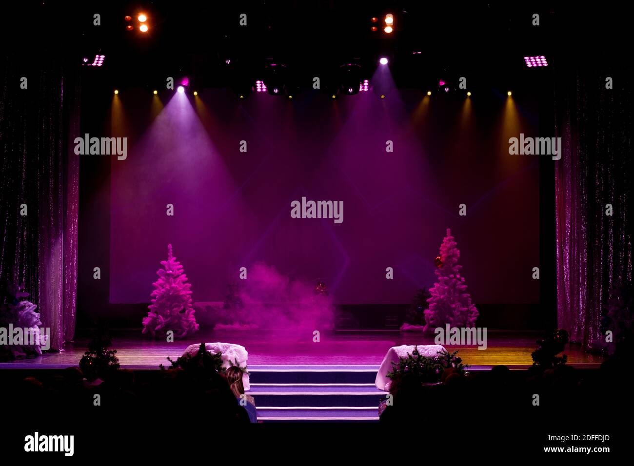 scene, stage light with colored spotlights and smoke, christmas tree ...