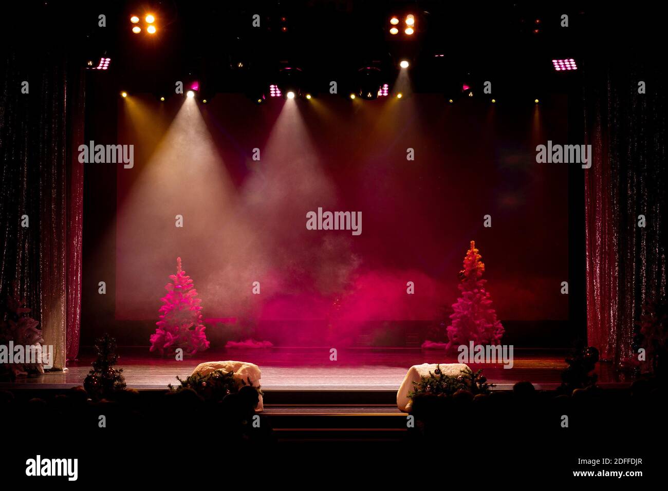 scene, stage light with colored spotlights and smoke, christmas tree ...