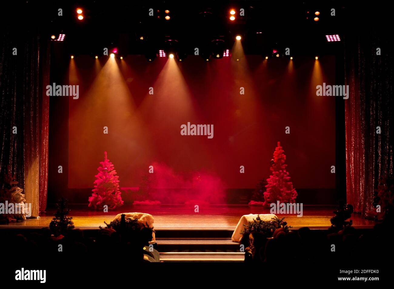 scene, stage light with colored spotlights and smoke, christmas tree ...