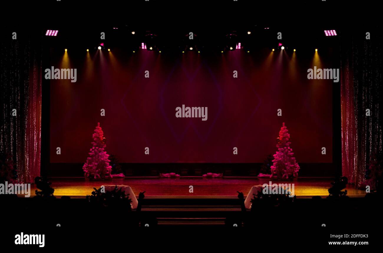 scene, stage light with colored spotlights and smoke, christmas tree ...