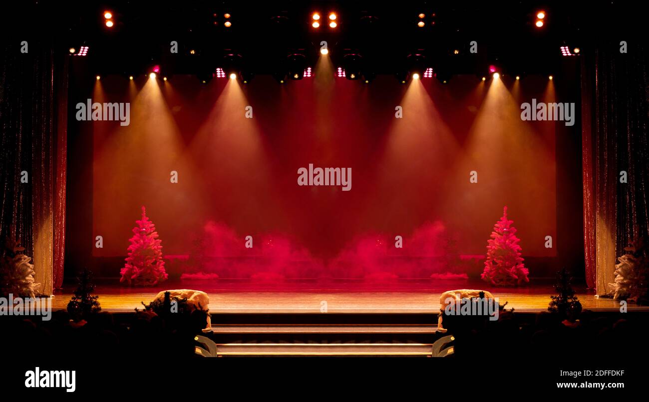 scene, stage light with colored spotlights and smoke, christmas tree ...