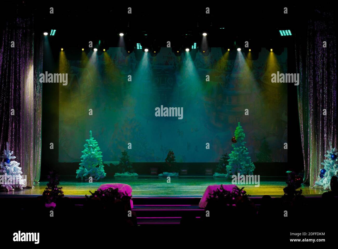 scene, stage light with colored spotlights and smoke, christmas tree ...