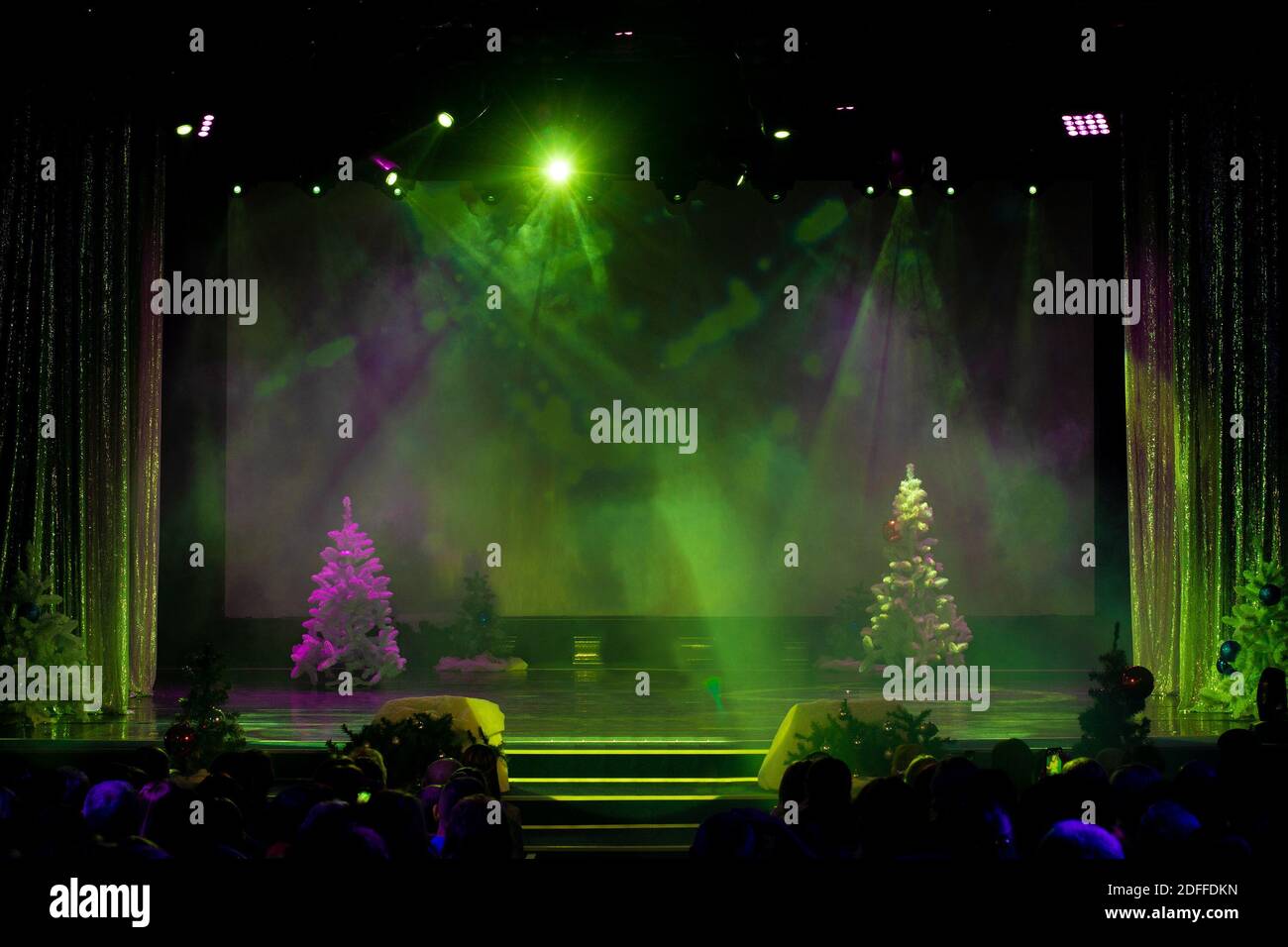 scene, stage light with colored spotlights and smoke, christmas tree ...