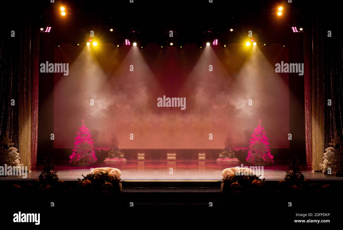 scene, stage light with colored spotlights and smoke, christmas tree ...