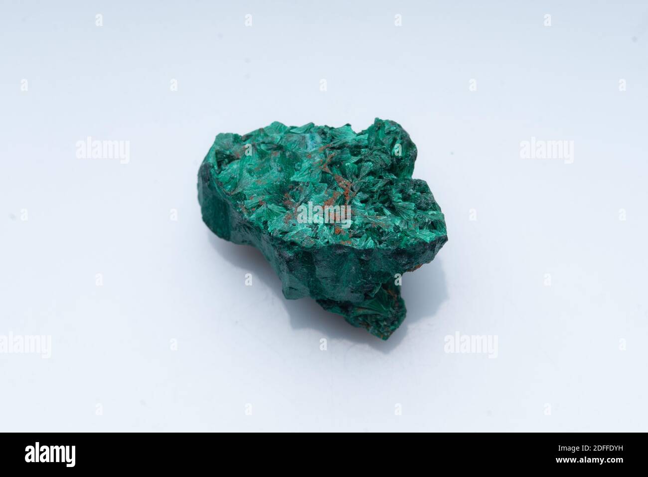 Malachite green ore on a white background. Natural green malachite ...