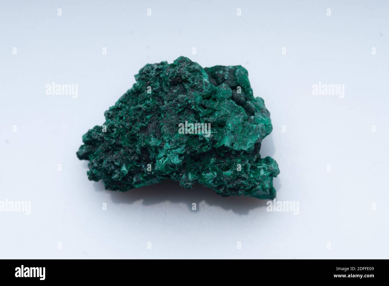 Malachite green ore on a white background. Natural green malachite ...