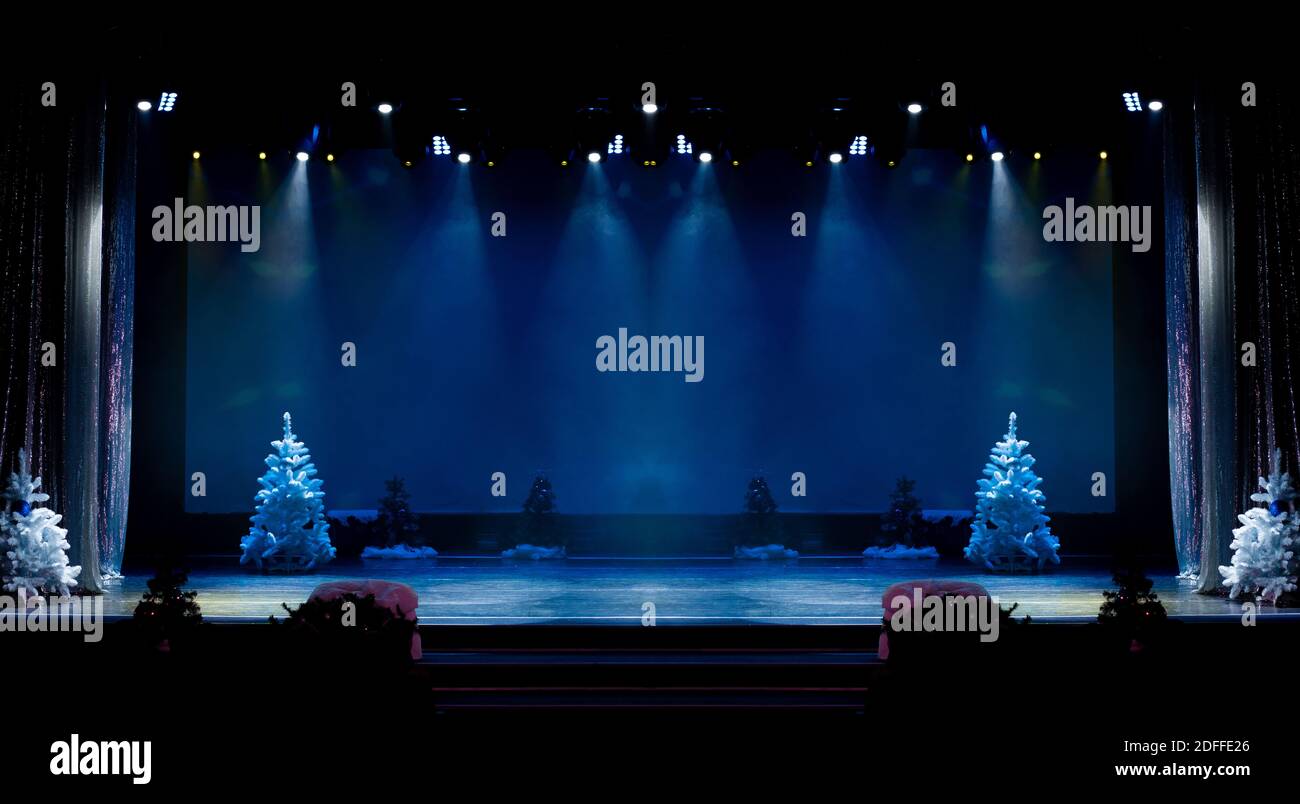 scene, stage light with colored spotlights and smoke, christmas tree ...