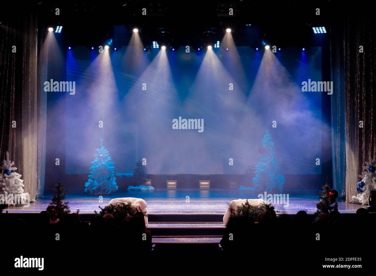 scene, stage light with colored spotlights and smoke, christmas tree ...
