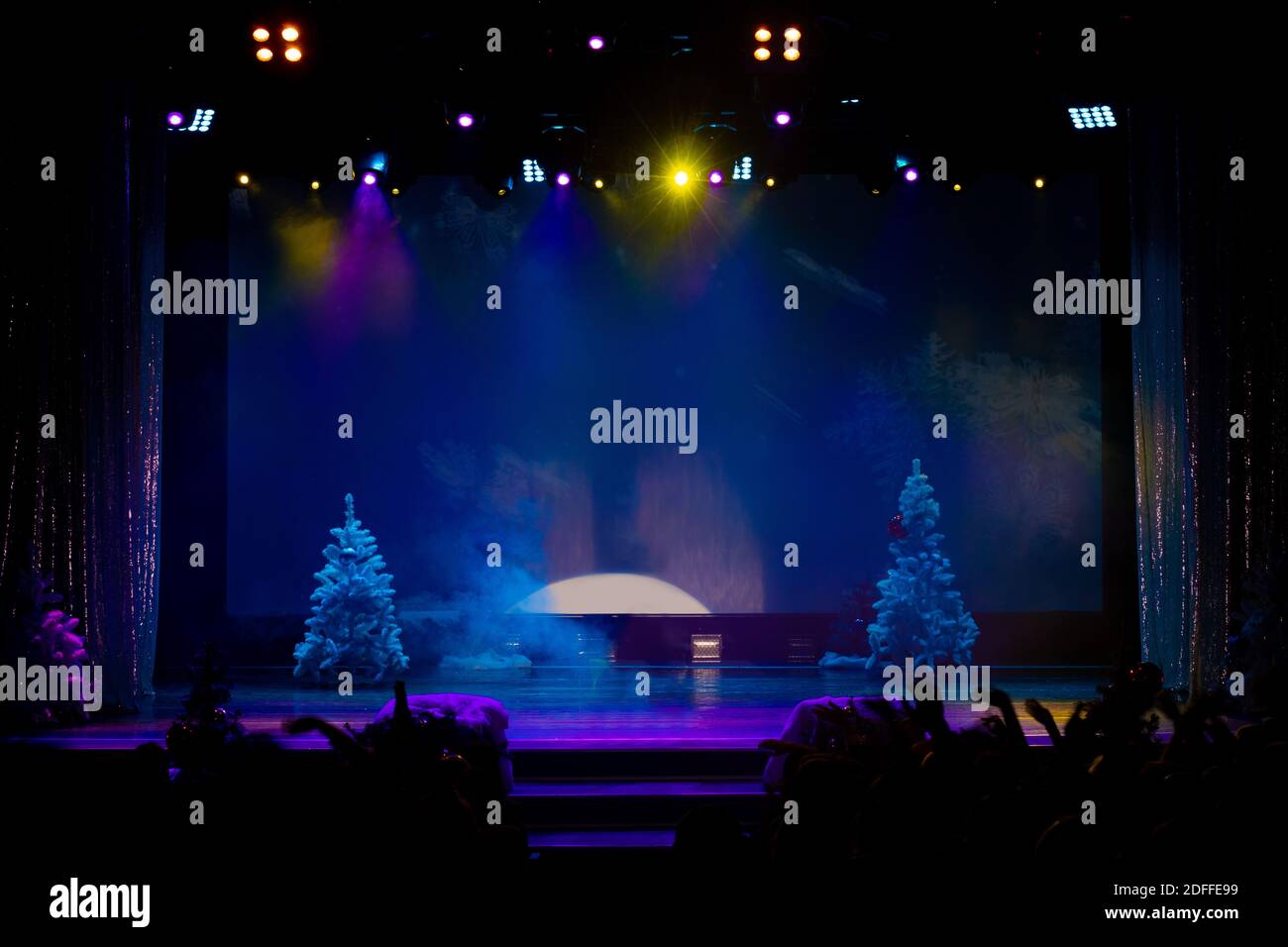scene, stage light with colored spotlights and smoke, christmas tree ...