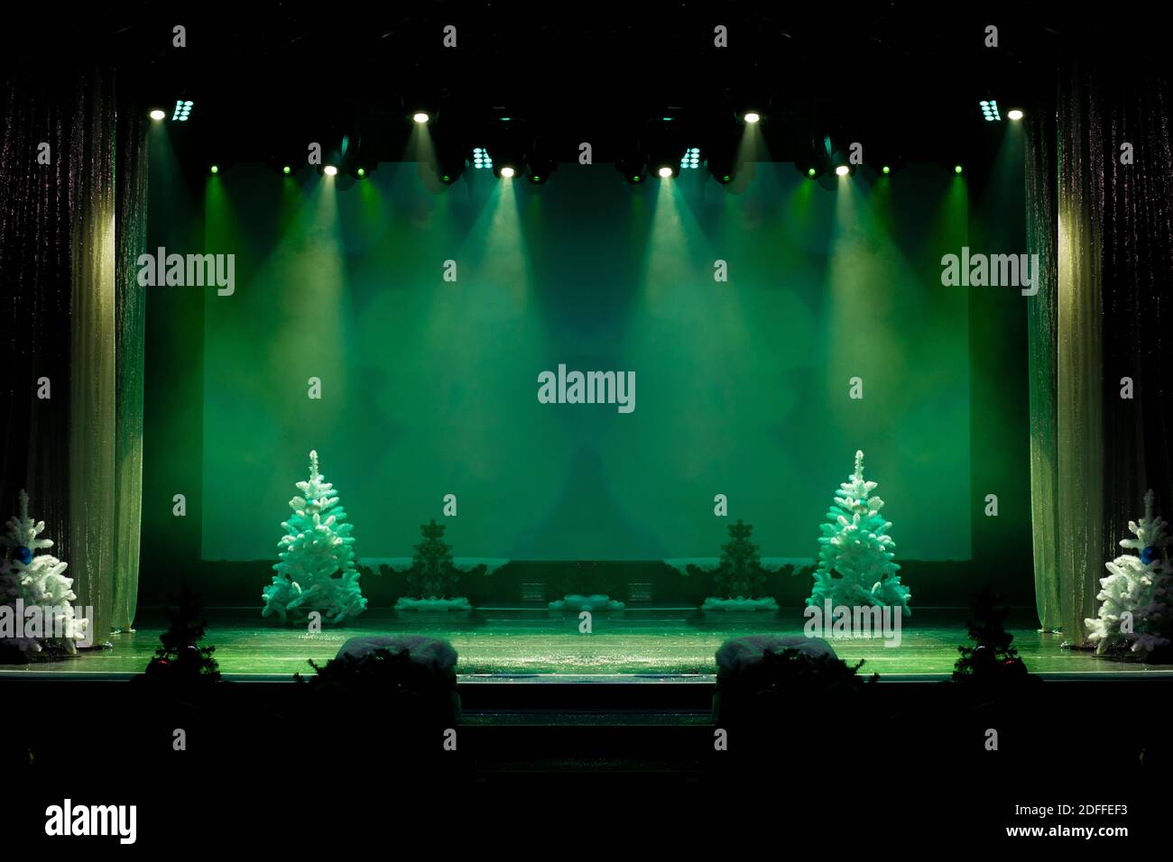 scene, stage light with colored spotlights and smoke, christmas tree ...