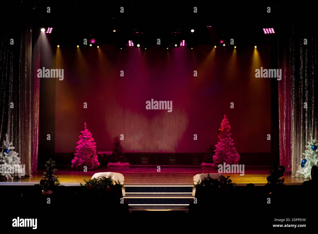 scene, stage light with colored spotlights and smoke, christmas tree ...