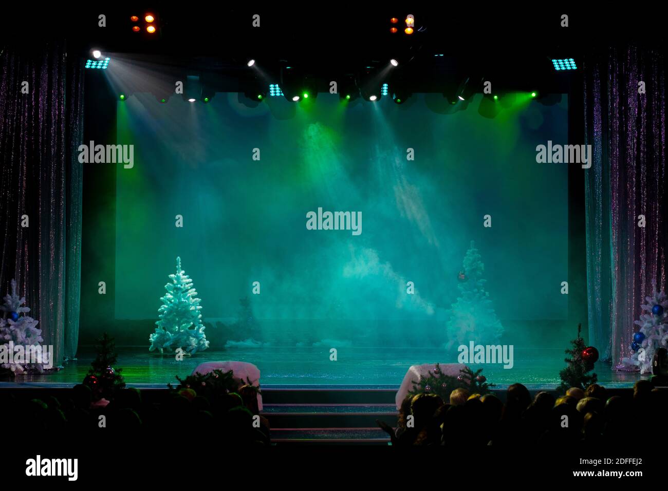 scene, stage light with colored spotlights and smoke, christmas tree ...