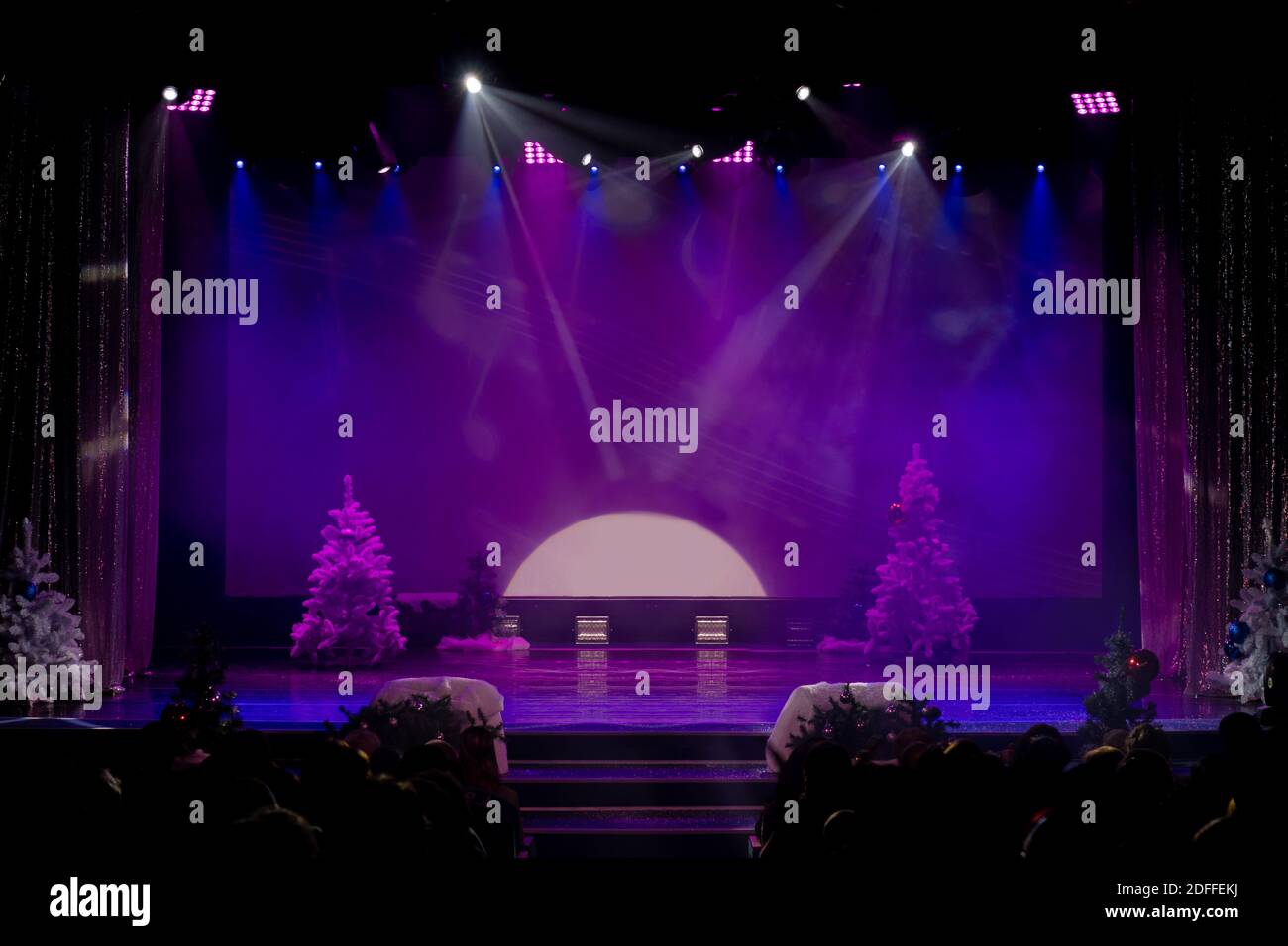 scene, stage light with colored spotlights and smoke, christmas tree ...