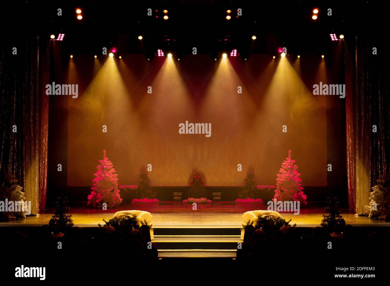 scene, stage light with colored spotlights and smoke, christmas tree ...