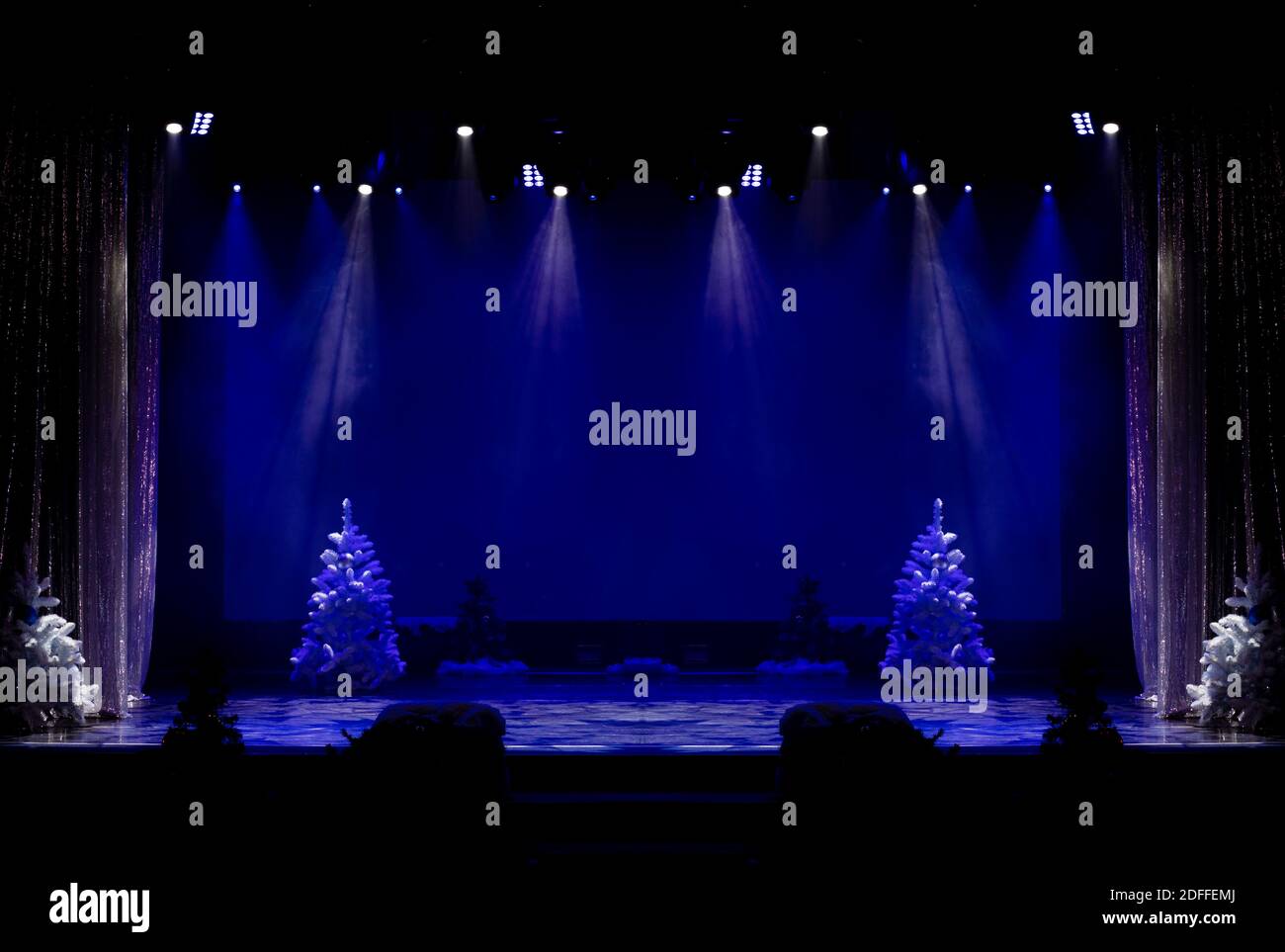 scene, stage light with colored spotlights and smoke, christmas tree ...