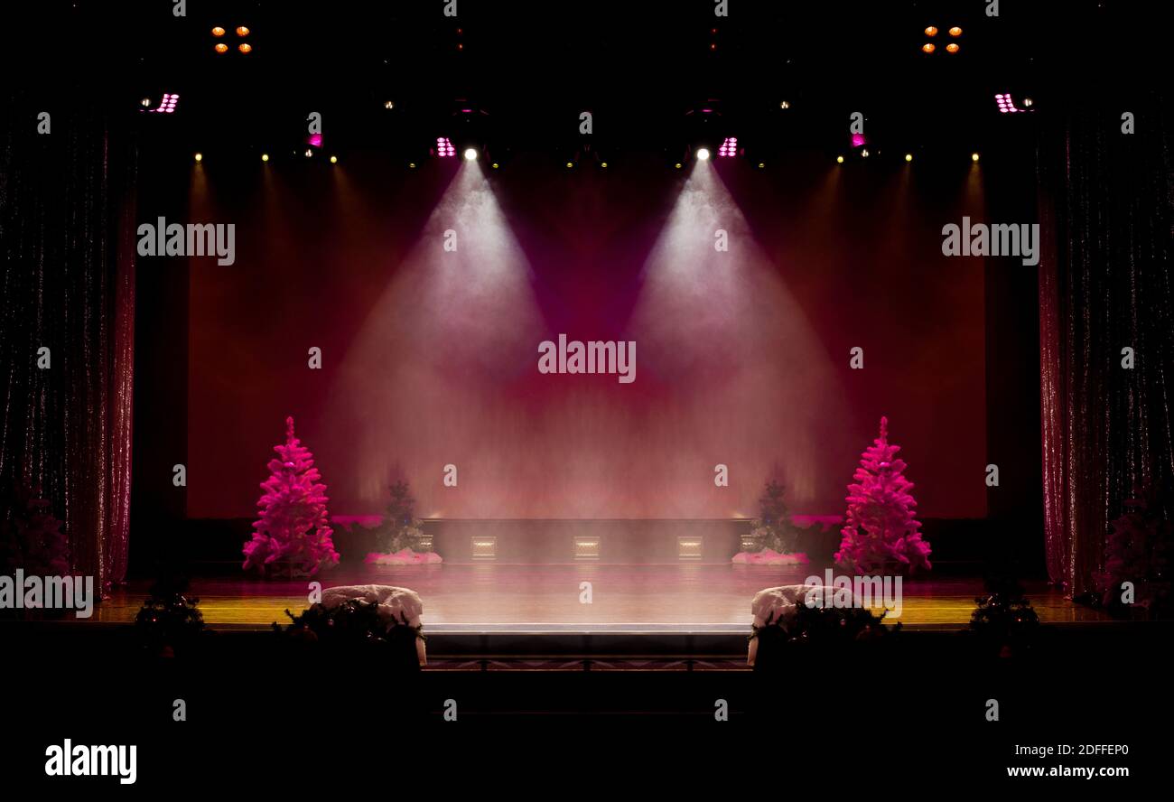 scene, stage light with colored spotlights and smoke, christmas tree ...