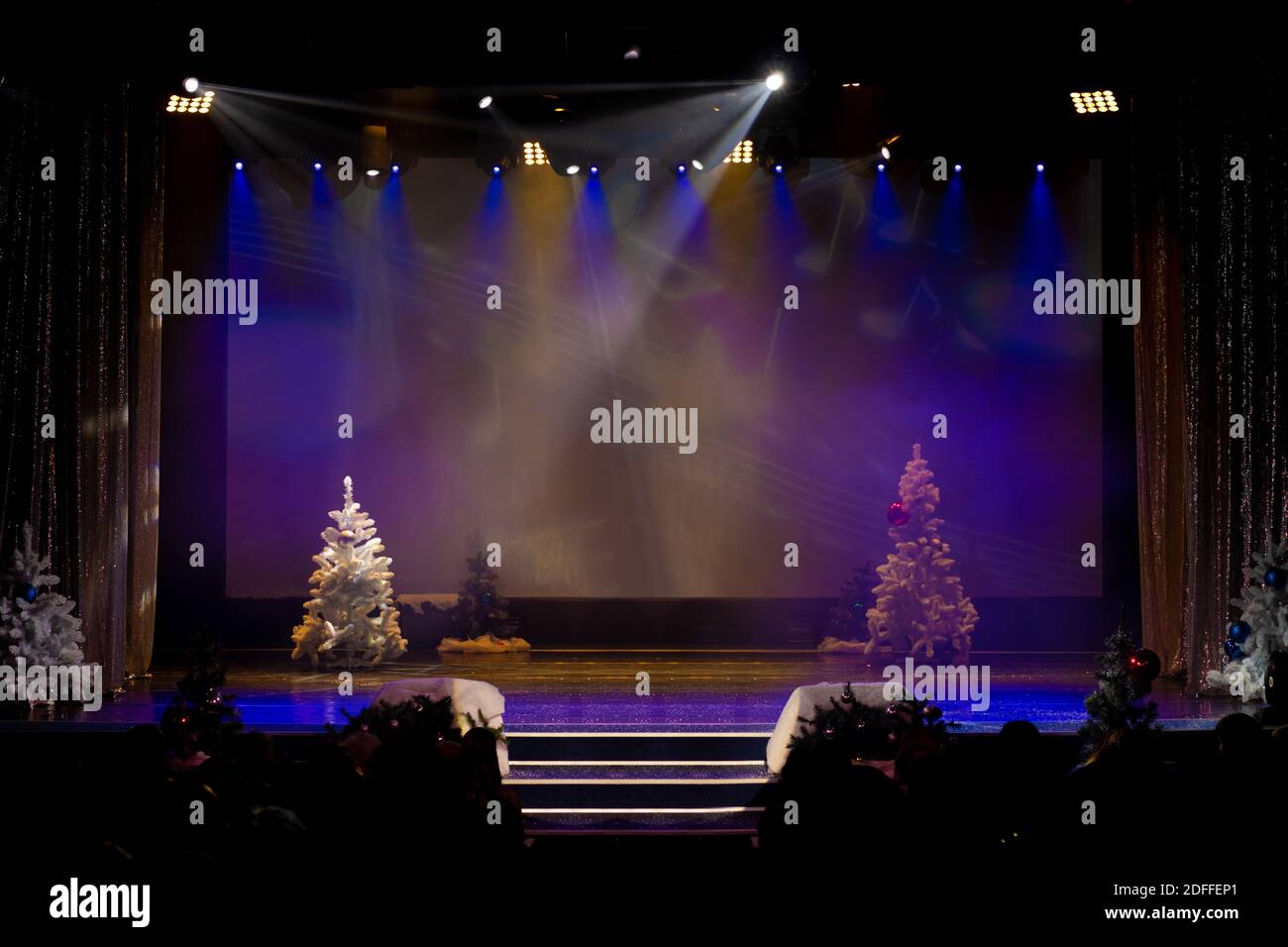 scene, stage light with colored spotlights and smoke, christmas tree ...