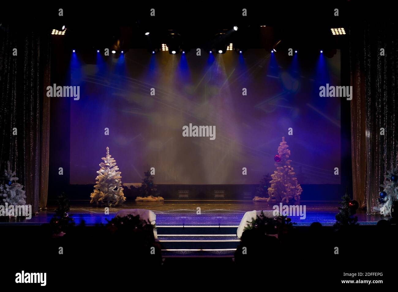 scene, stage light with colored spotlights and smoke, christmas tree ...