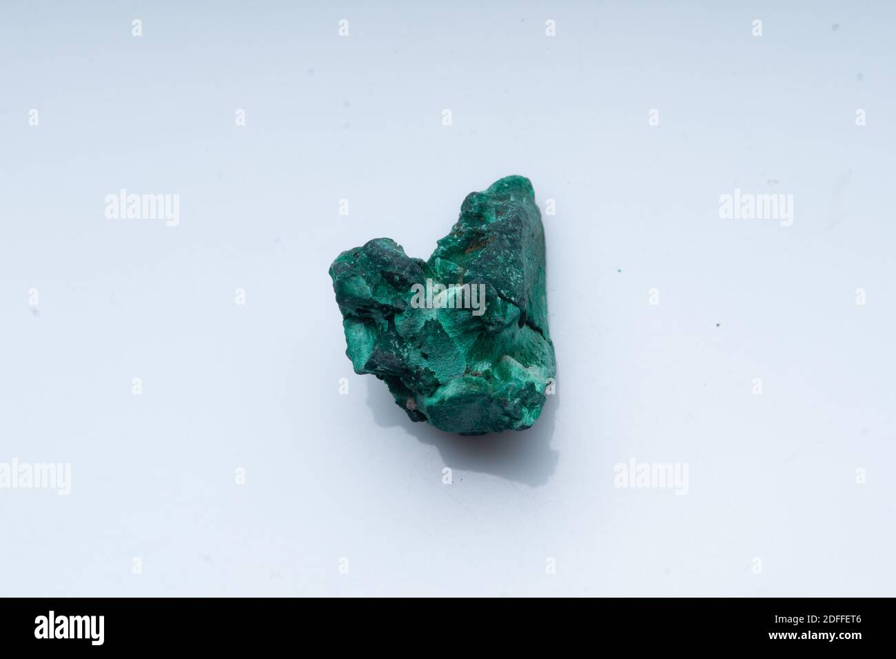 Malachite green ore on a white background. Natural green malachite ...