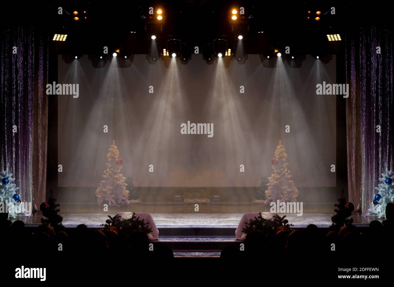 scene, stage light with colored spotlights and smoke, christmas tree ...