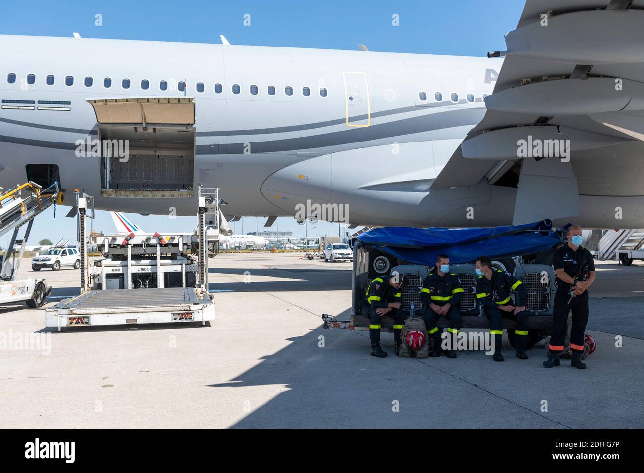 Hand Out. French Civil Security personnel are seen boarding an Airbus ...