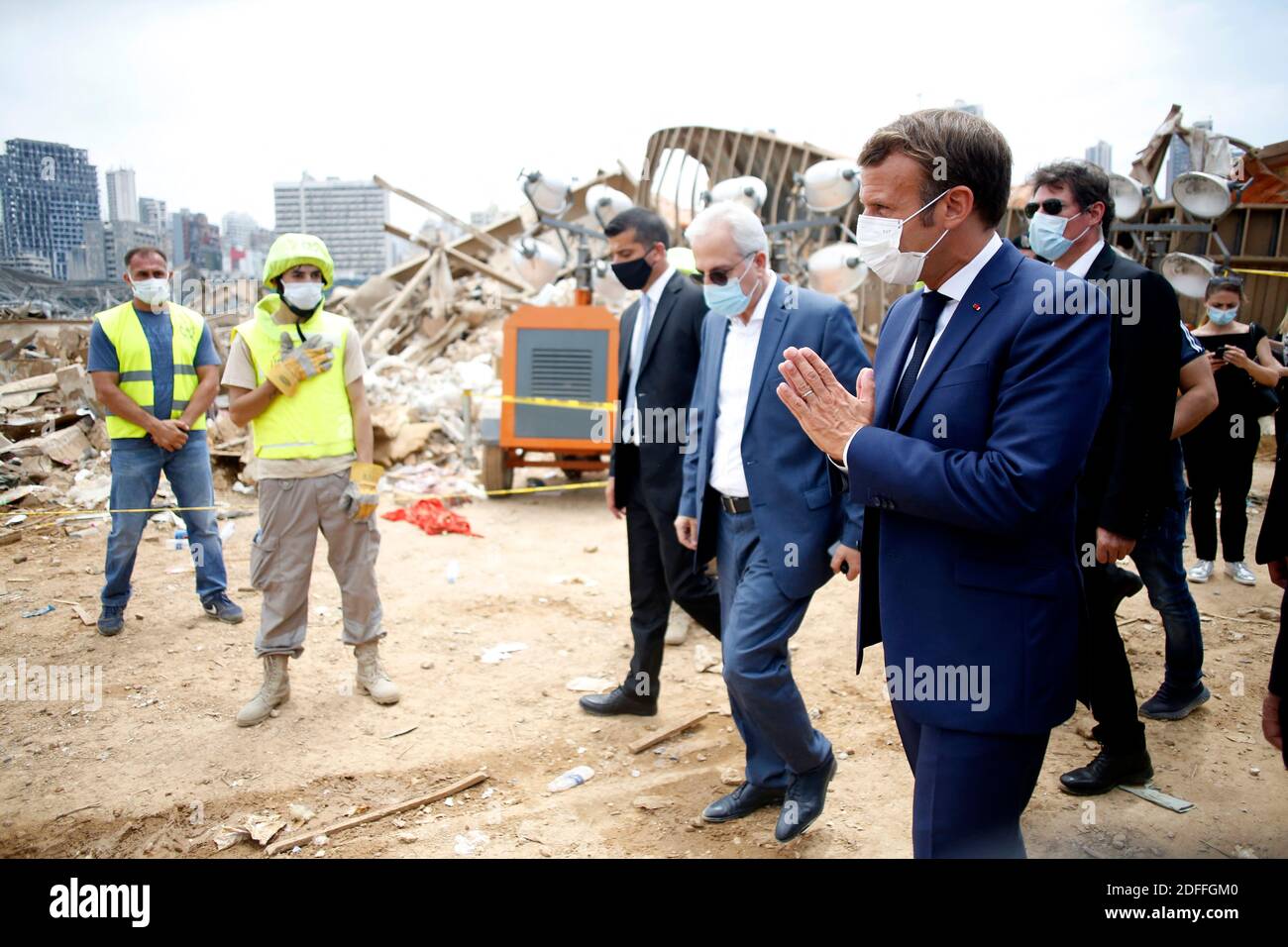 French President Emmanuel Macron, right, salutes as he arrives at the ...